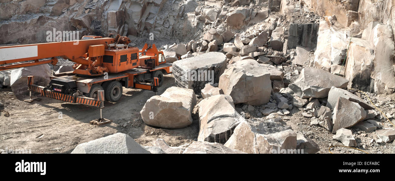 Granite quarry. Working mining machines. Mining industry Stock Photo ...