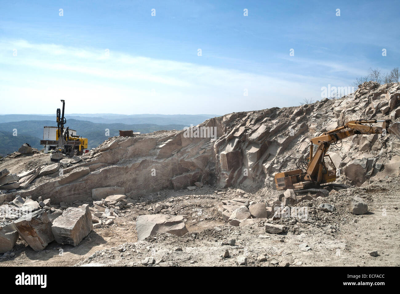 Granite quarry. Working mining machines. Mining industry Stock Photo ...