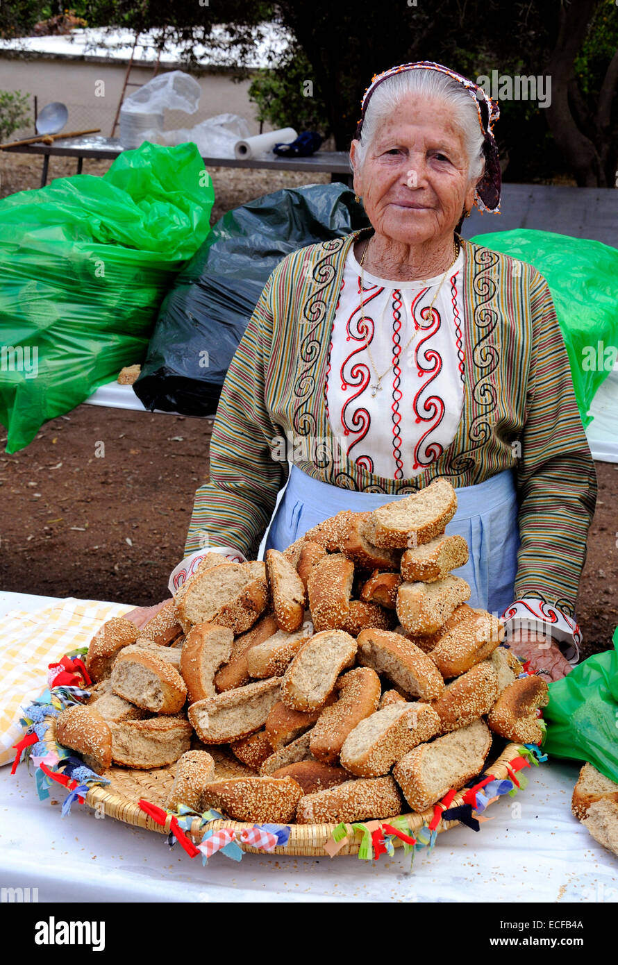 A villager at the Amargeti Community Festival giving locally produced ...