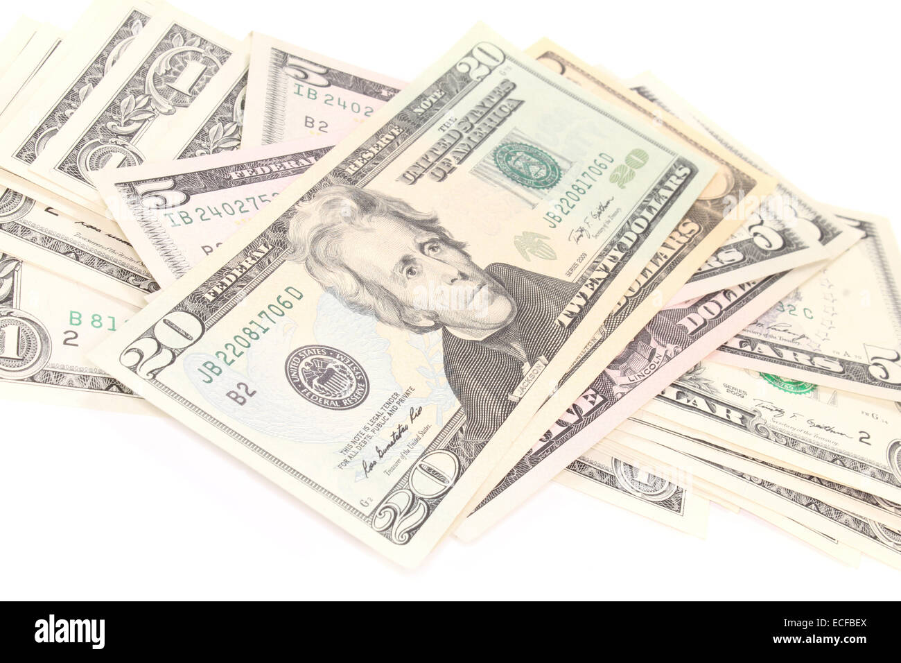 a stack of many colorful dollar bills on white background Stock Photo ...