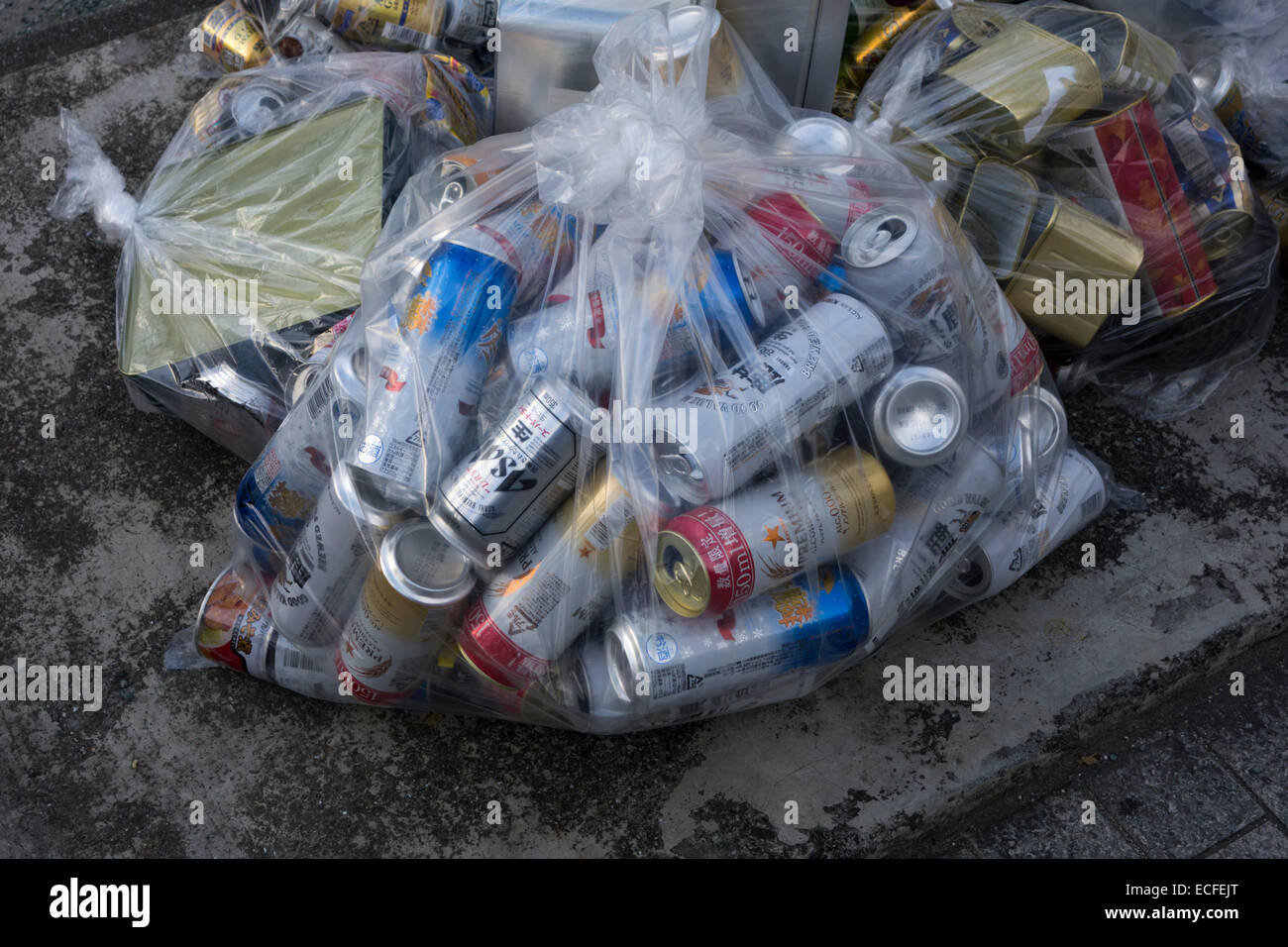 Cans awaiting collection in a Japanese city Stock Photo - Alamy