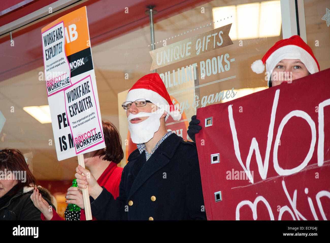 Bristol, UK. 13th December, 2014. Campaigners dressed as Santa protest ...
