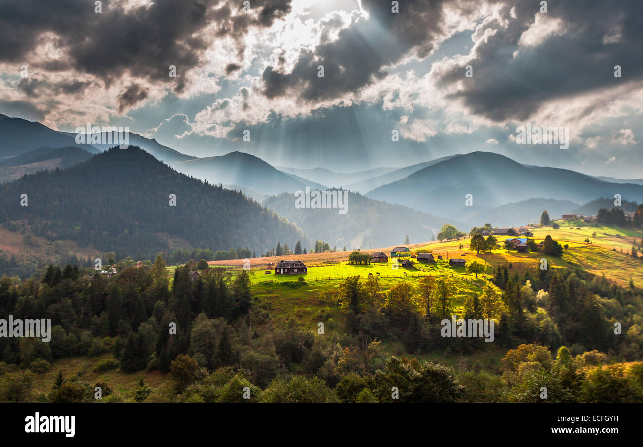 Beautiful light beam in morning with village on mountain valleys Stock ...