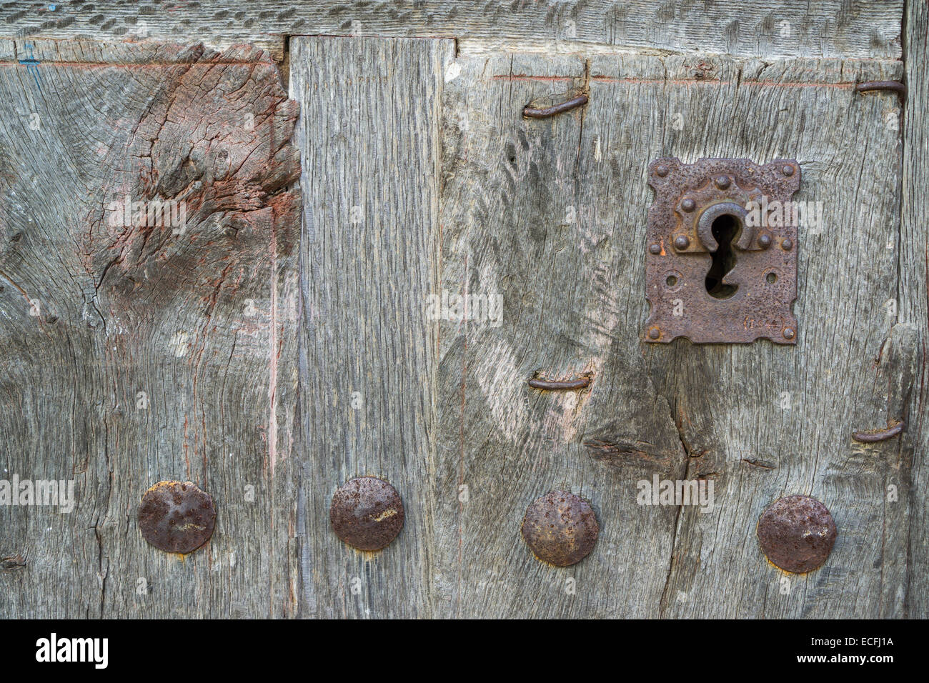 Old run-down wooden door and iron lock Stock Photo - Alamy