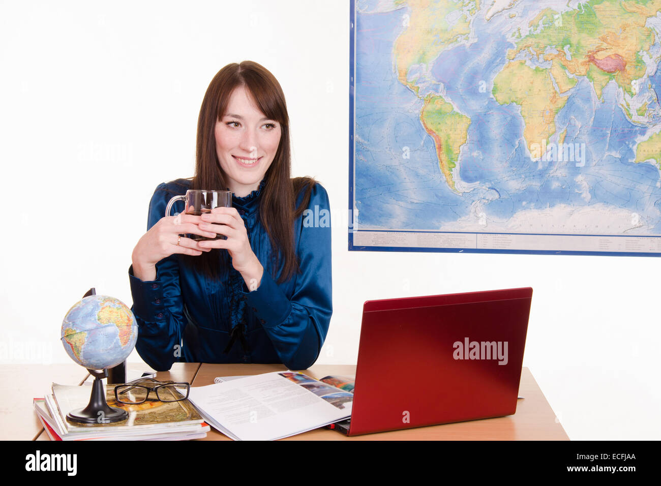 Young beautiful employee in the office of the travel agency Stock Photo ...