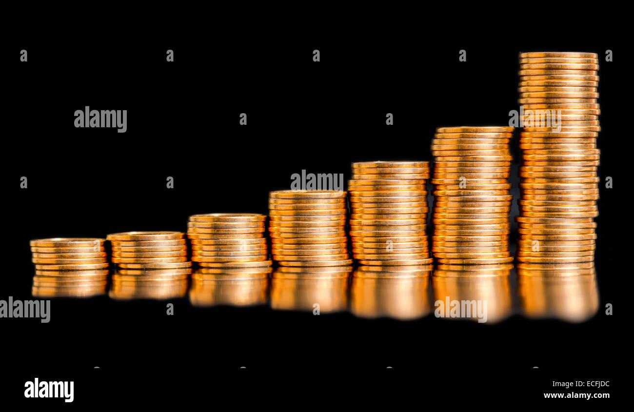 Business chart concept of golden coins, shows an increase is isolated ...