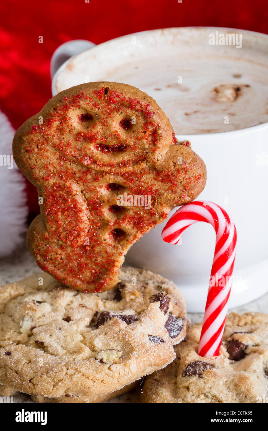 hot chocolate with a gingerbread man with a missing foot using a candy ...
