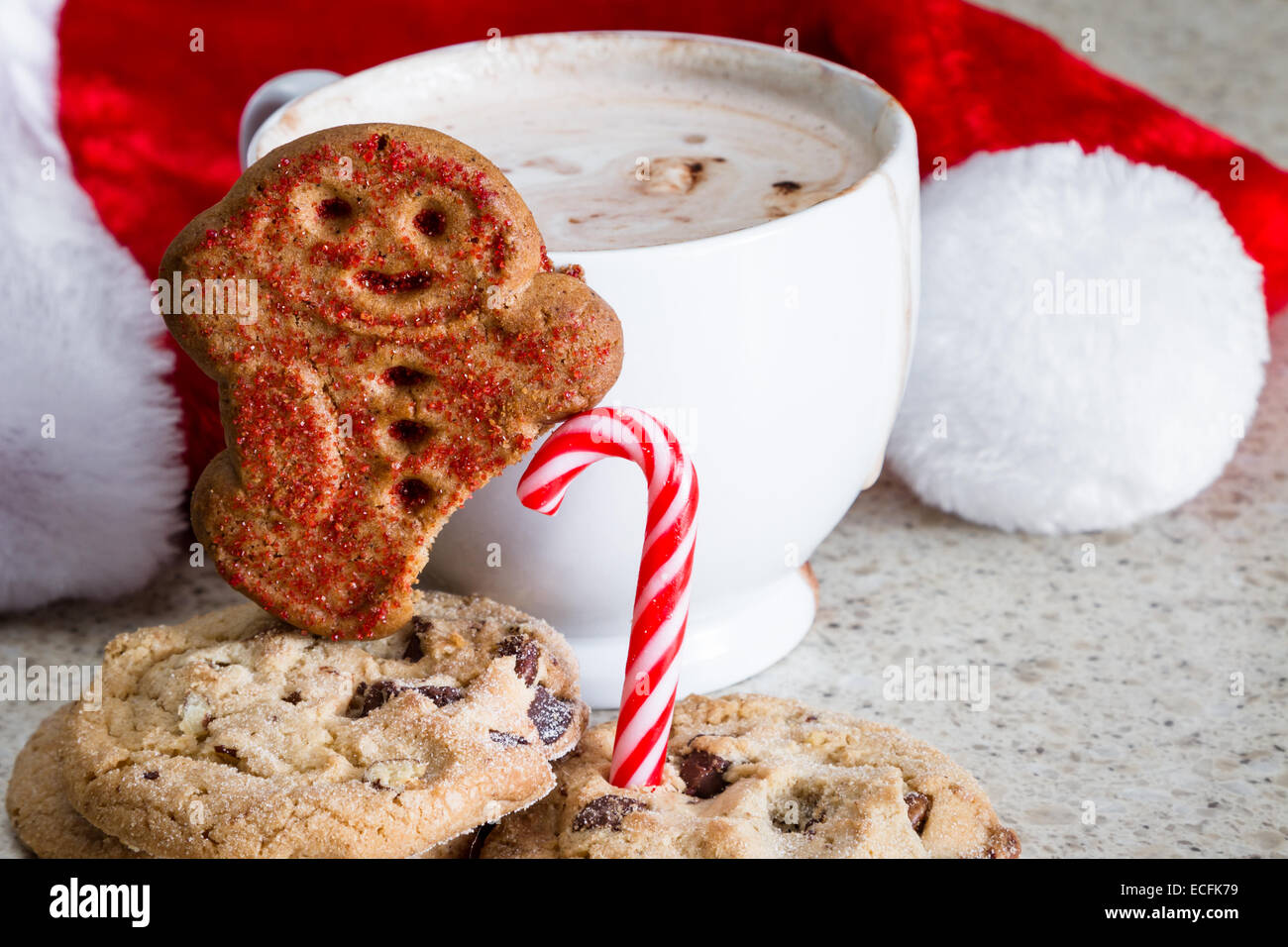 hot chocolate with a gingerbread man with a missing foot using a candy ...