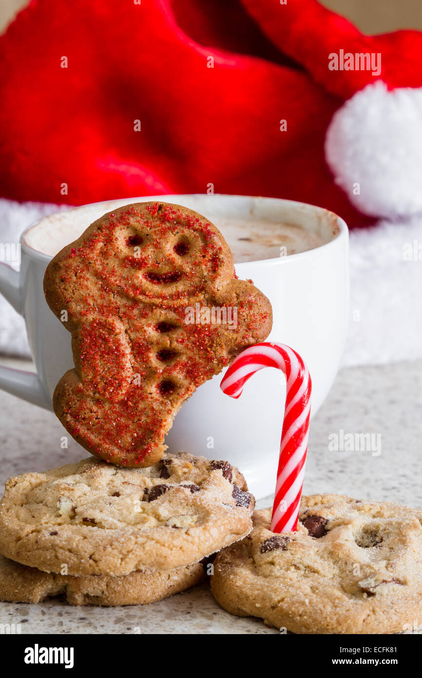 hot chocolate with a gingerbread man with a missing foot using a candy ...