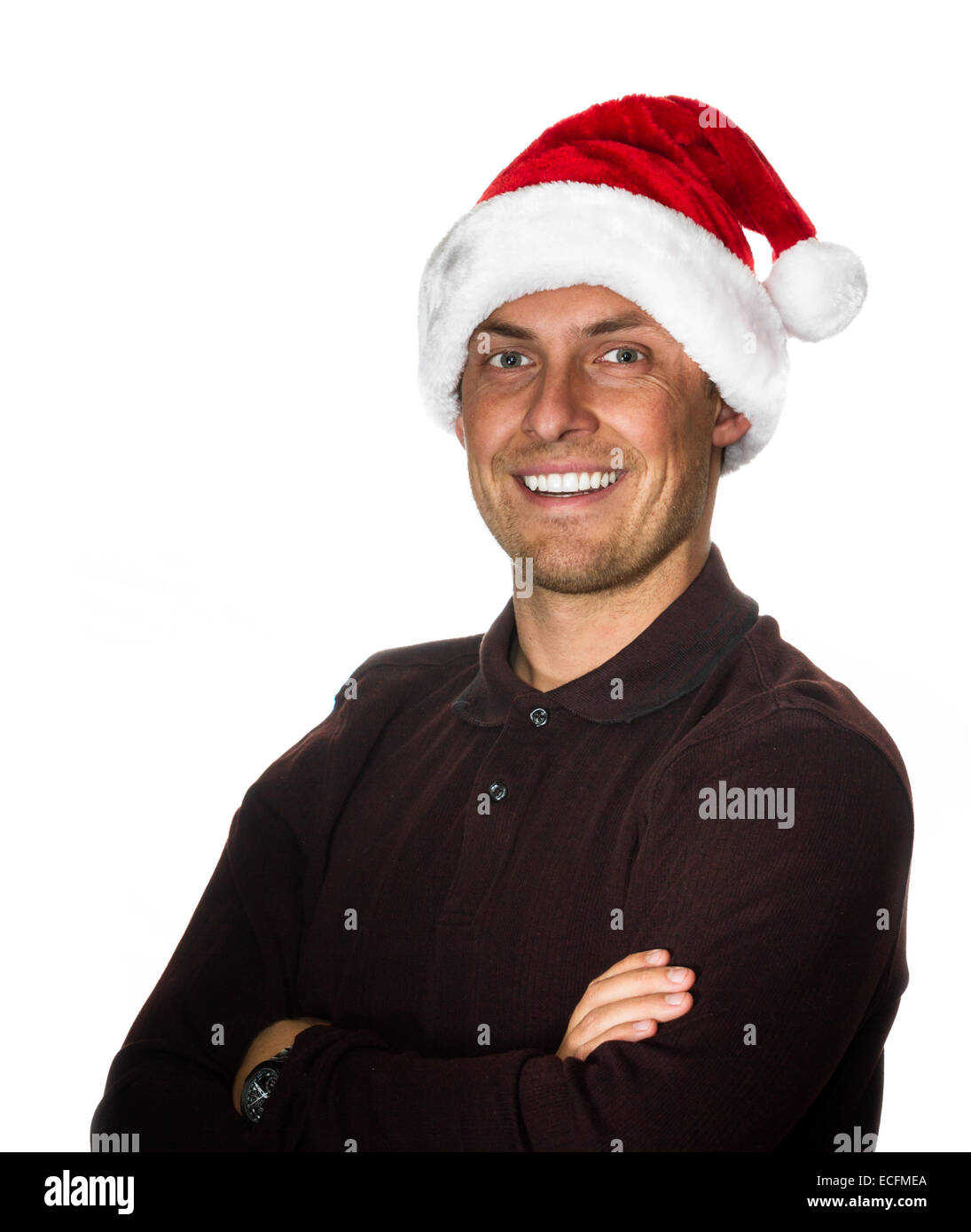 young smiling man wearing a santa hat isolated on a white background ...