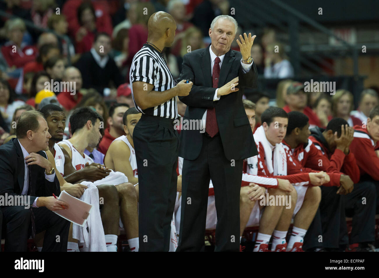 December 13, 2014: Bo Ryan talks with an official during the NCAA ...