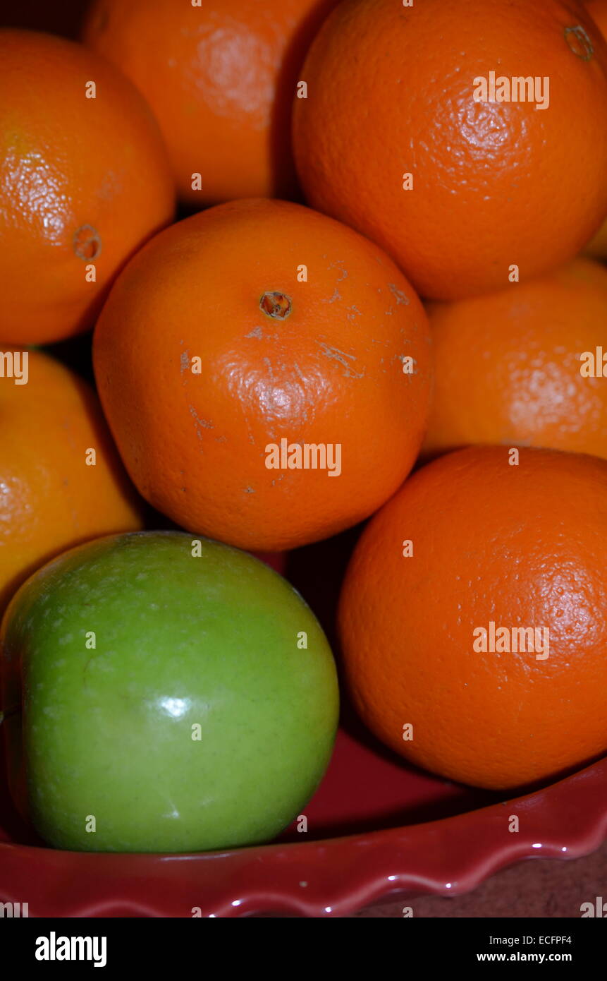 seven oranges and one apple Stock Photo - Alamy