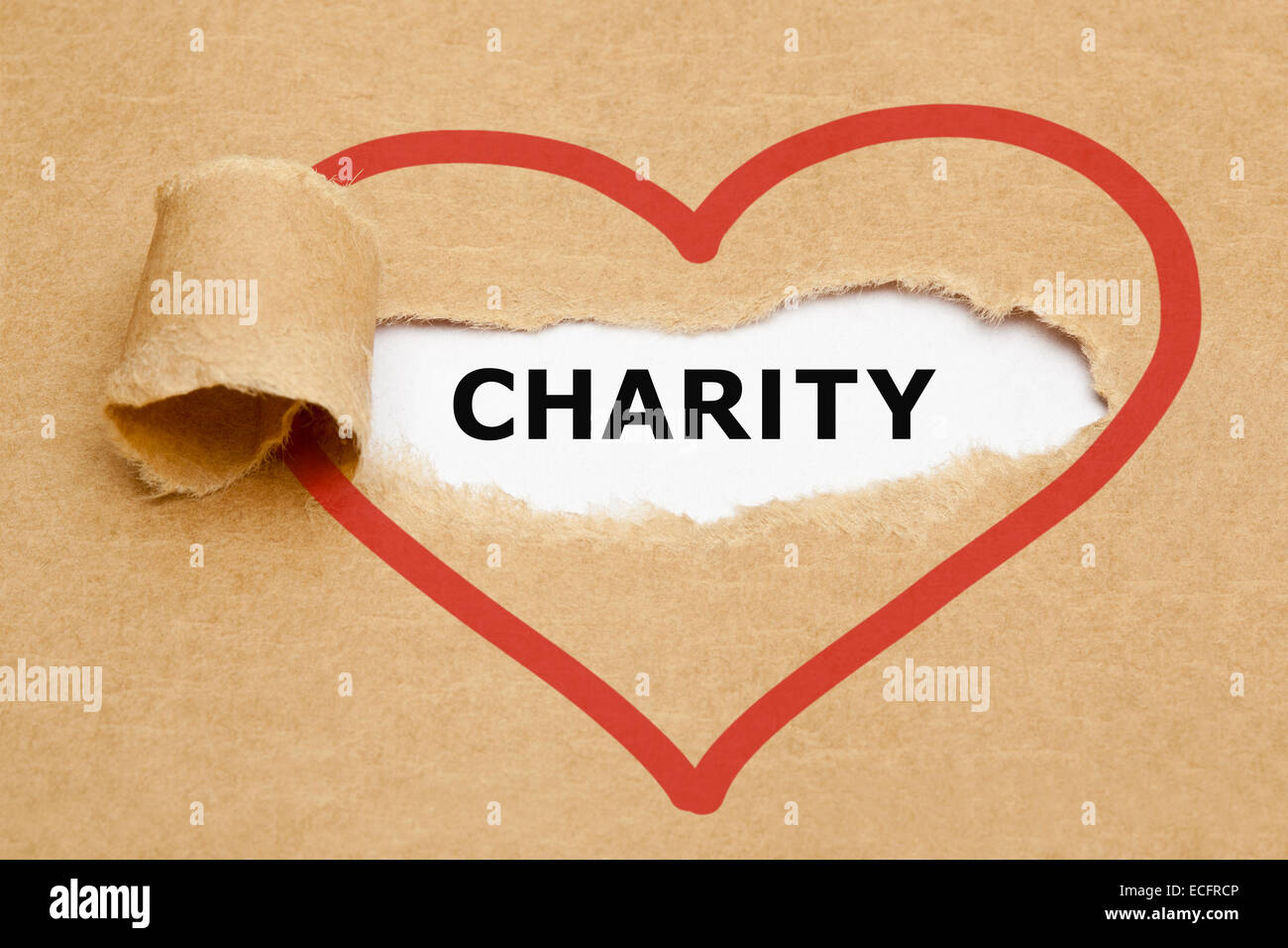 Charity appearing behind torn brown paper Stock Photo - Alamy