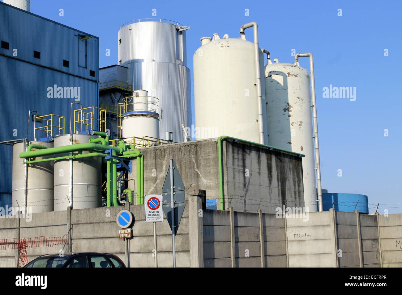 outside of the factory with smokestack in north Italy Stock Photo - Alamy