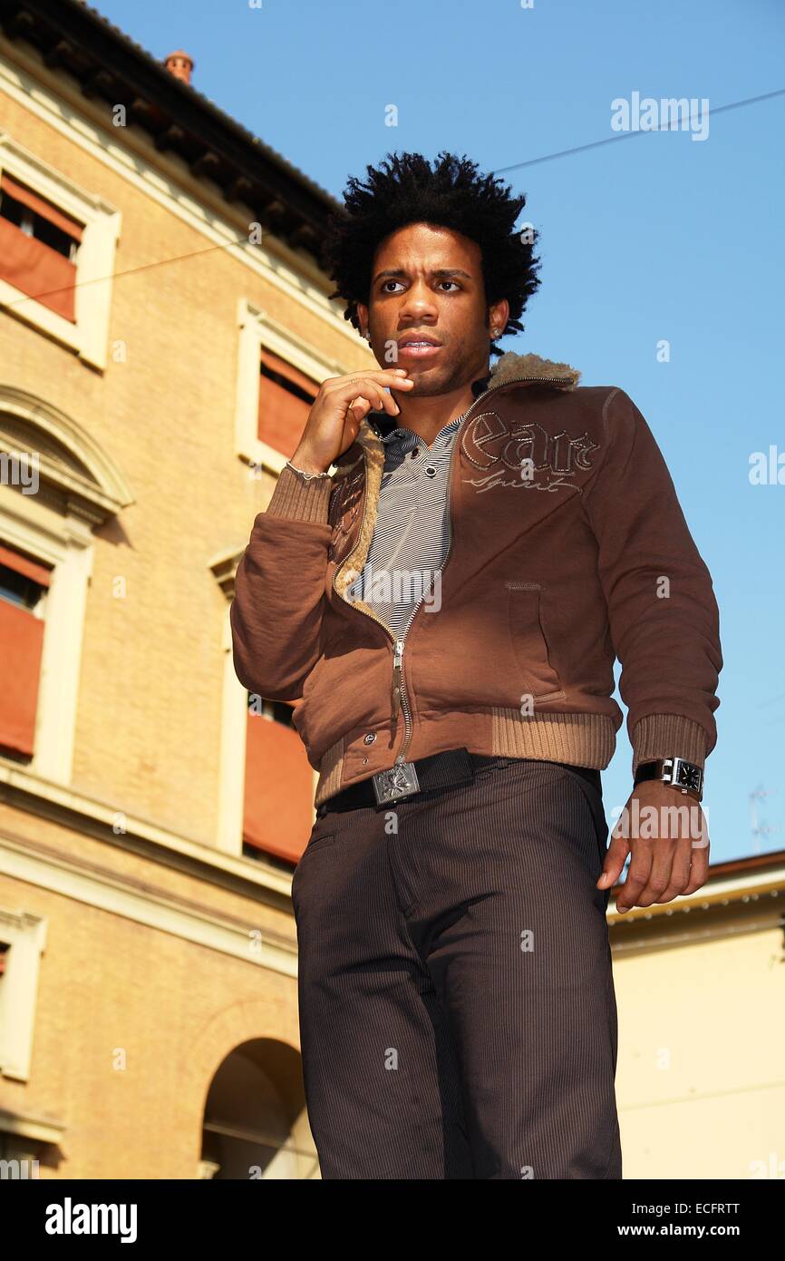 Portrait of a handsome young african man in the street Portrait of ...