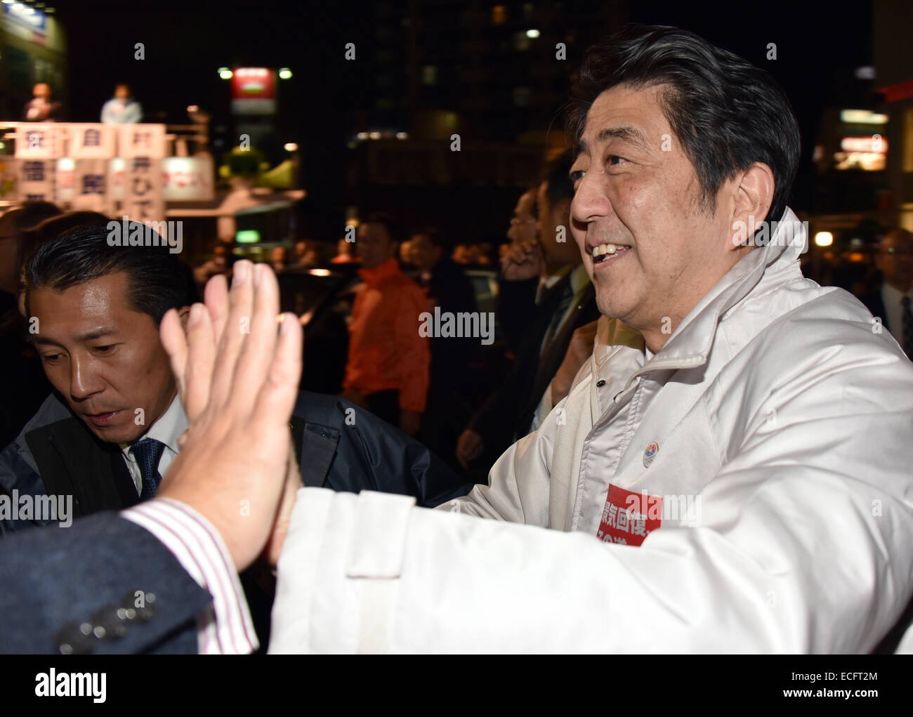 Tokyo, Japan. 12th Dec, 2014. Japan's Prime Minister Shinzo Abe shakes ...