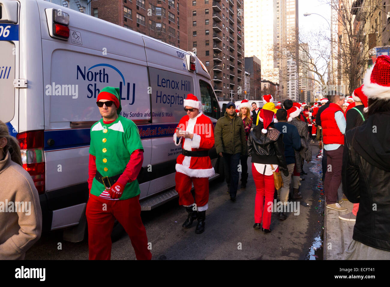New York, USA. 13th December, 2014. Revelers dressed as Santa Claus ...