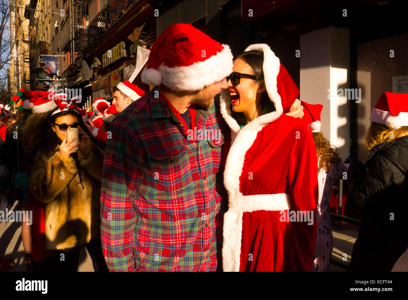 New York, USA. 13th December, 2014. Revelers dressed as Santa Claus ...