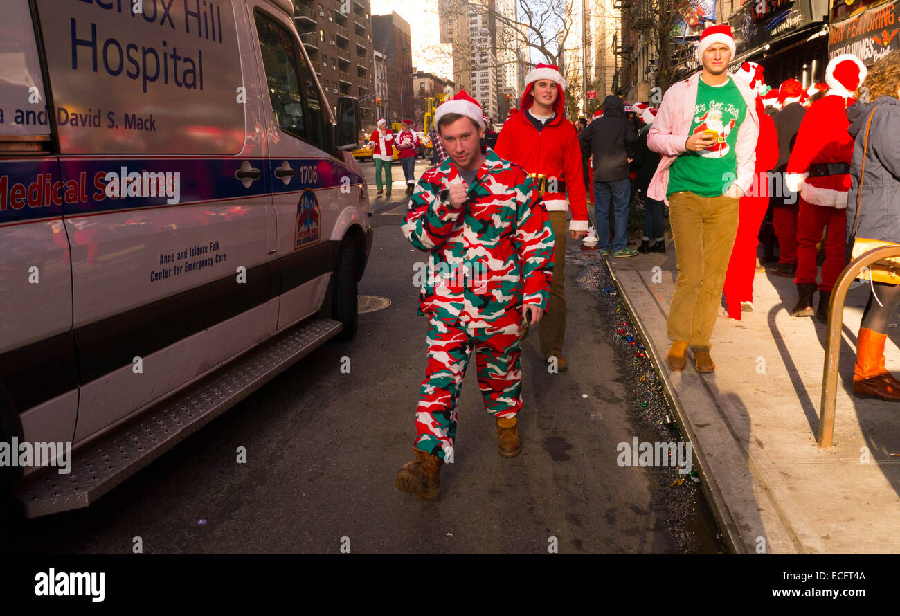 New York, USA. 13th December, 2014. Revelers dressed as Santa Claus ...