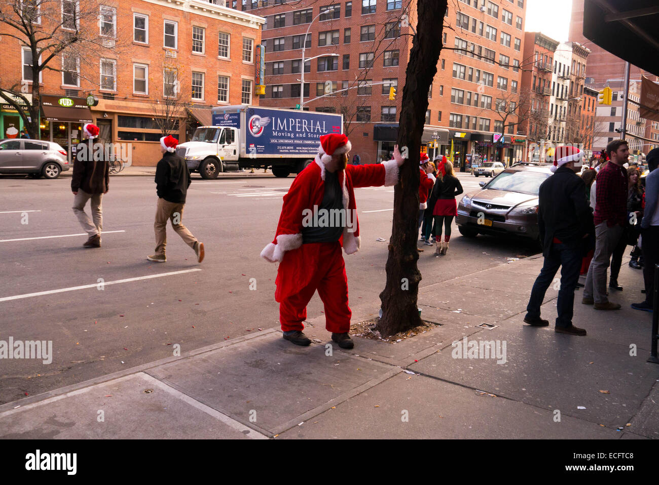New York, USA. 13th December, 2014. Revelers dressed as Santa Claus ...