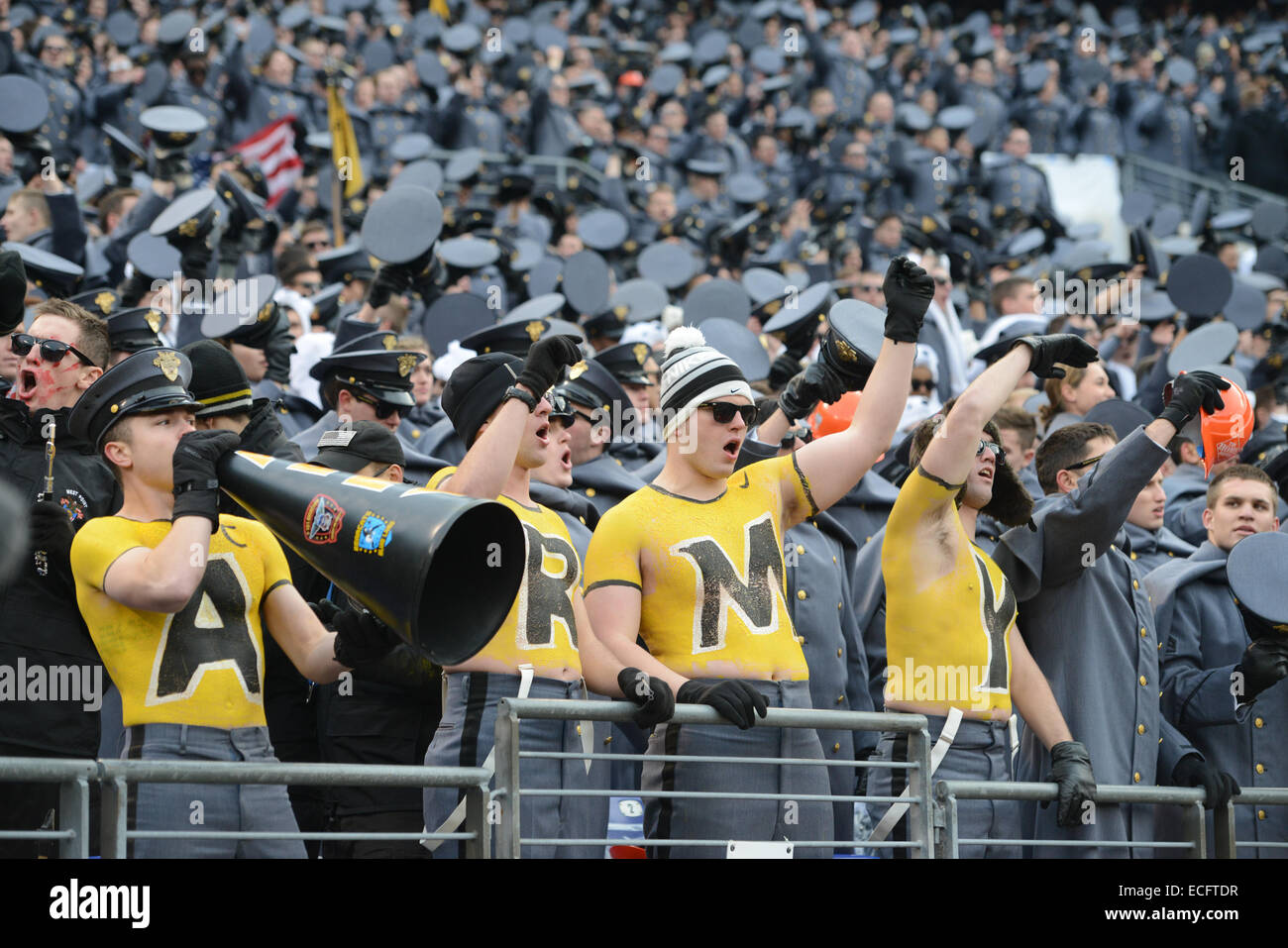 DEC 13, 2014 : Army Cadets in yellow body paint cheer during the 115th ...