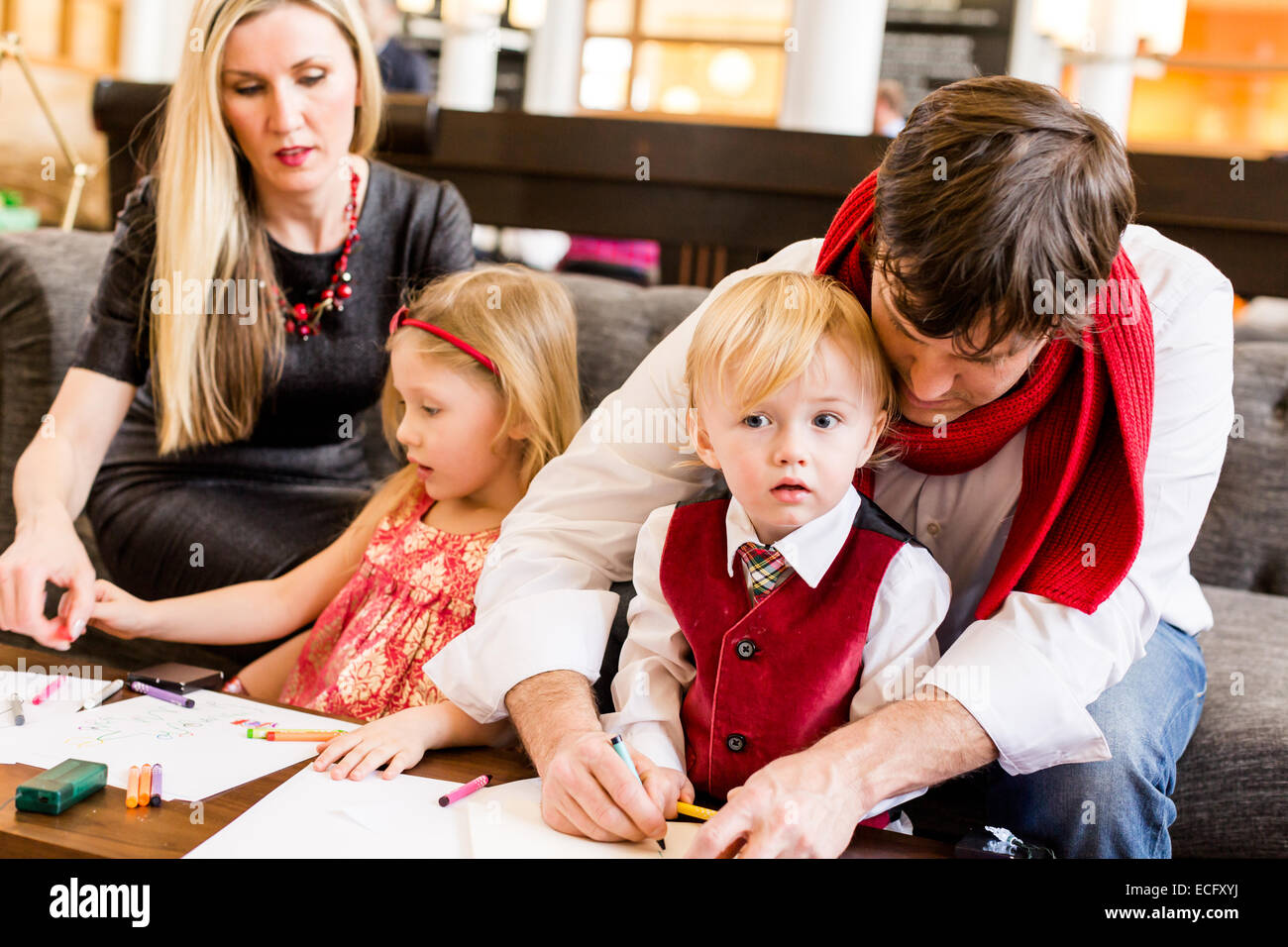 Young family having fun with their children Stock Photo - Alamy