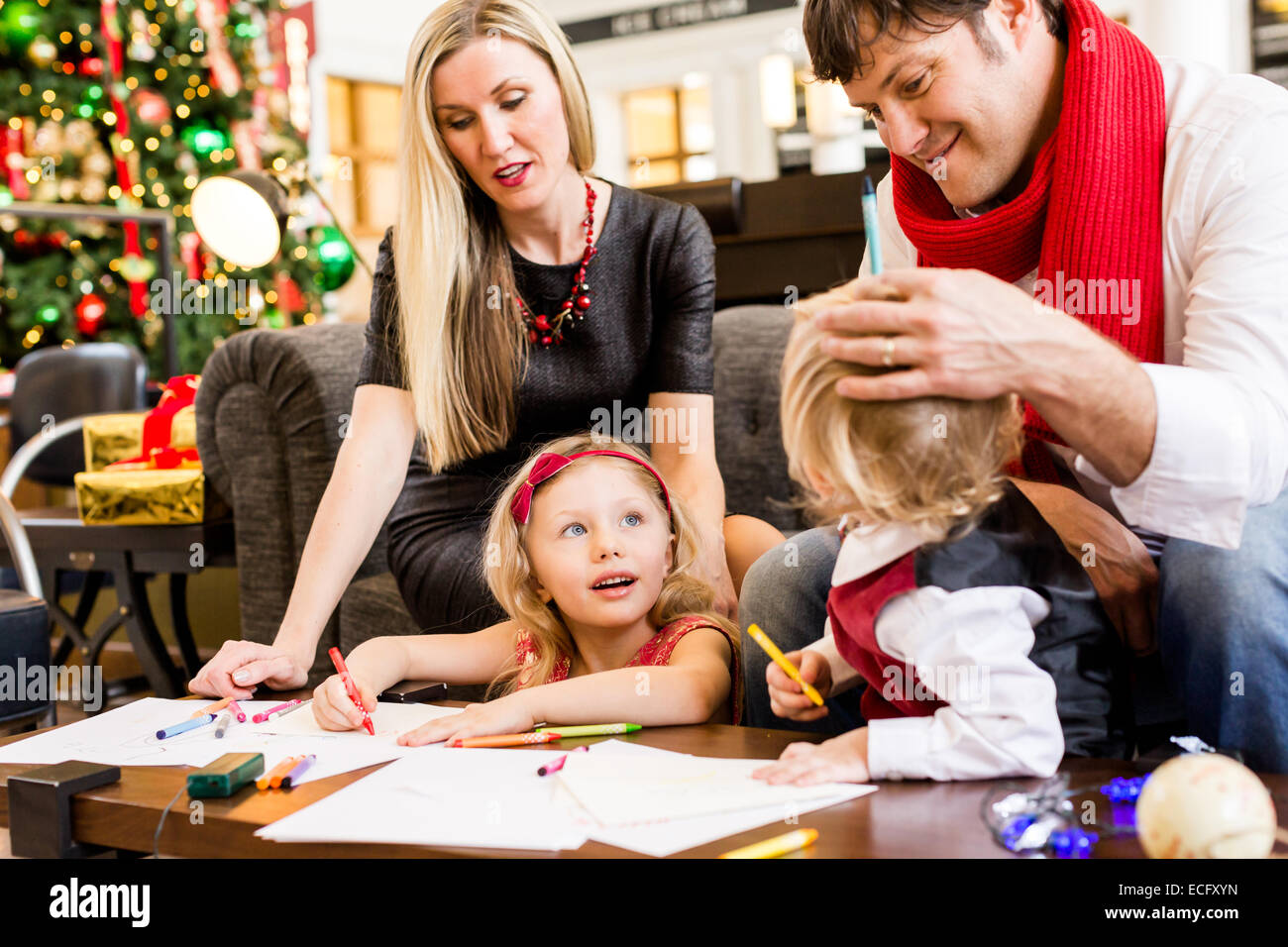 Young family having fun with their children Stock Photo - Alamy