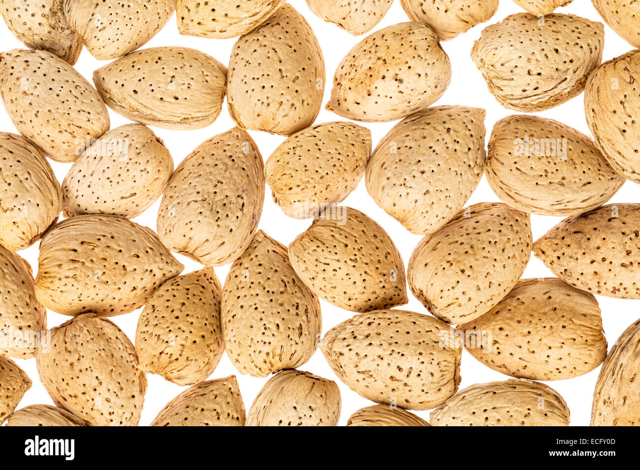 almond nuts in shells against white background Stock Photo - Alamy