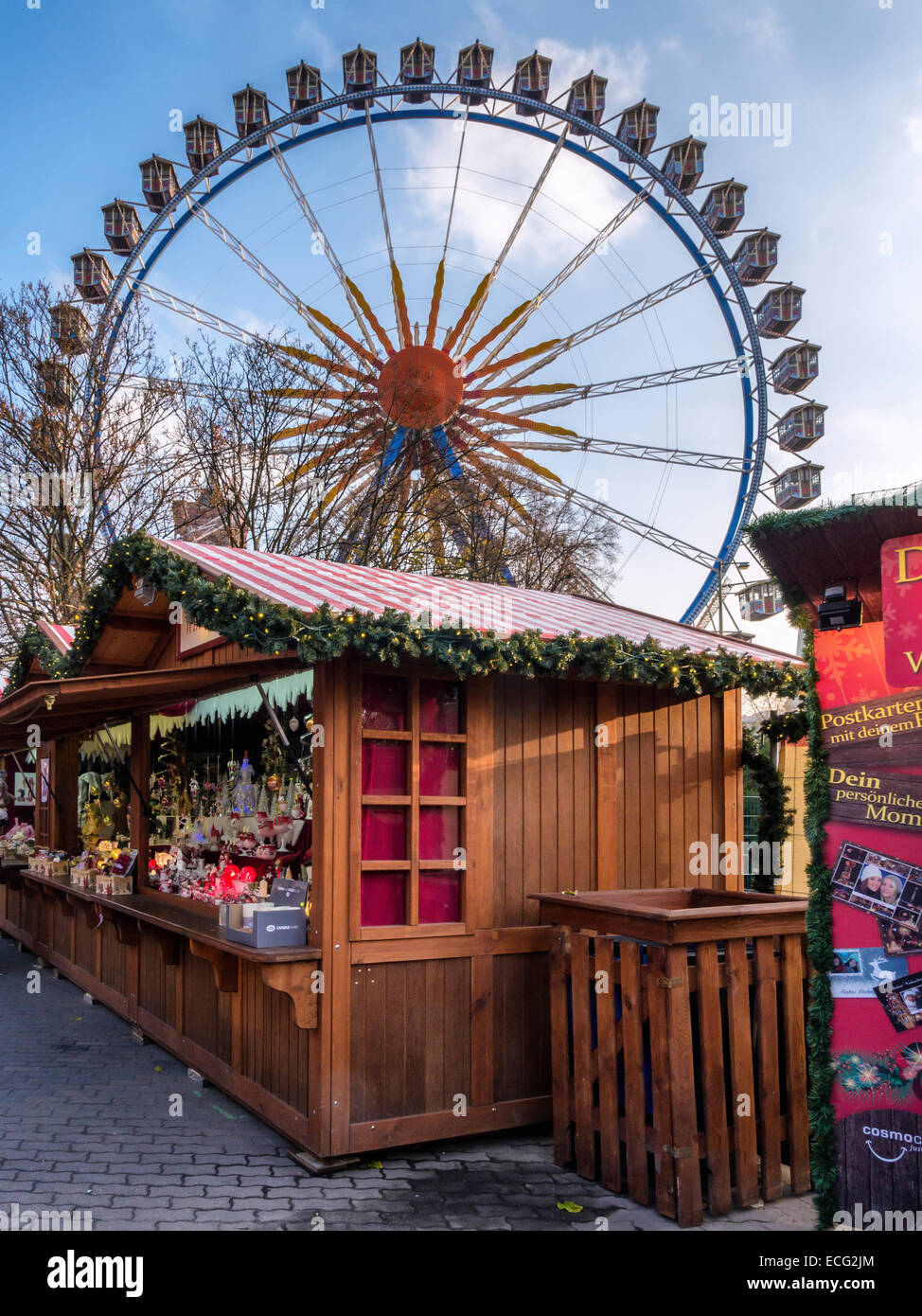 Old ferris wheel with traditional cabins and wooden stalls at Berlin ...