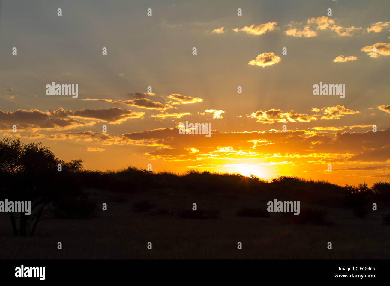 Sun dropping down the hill in a african landscape Stock Photo - Alamy