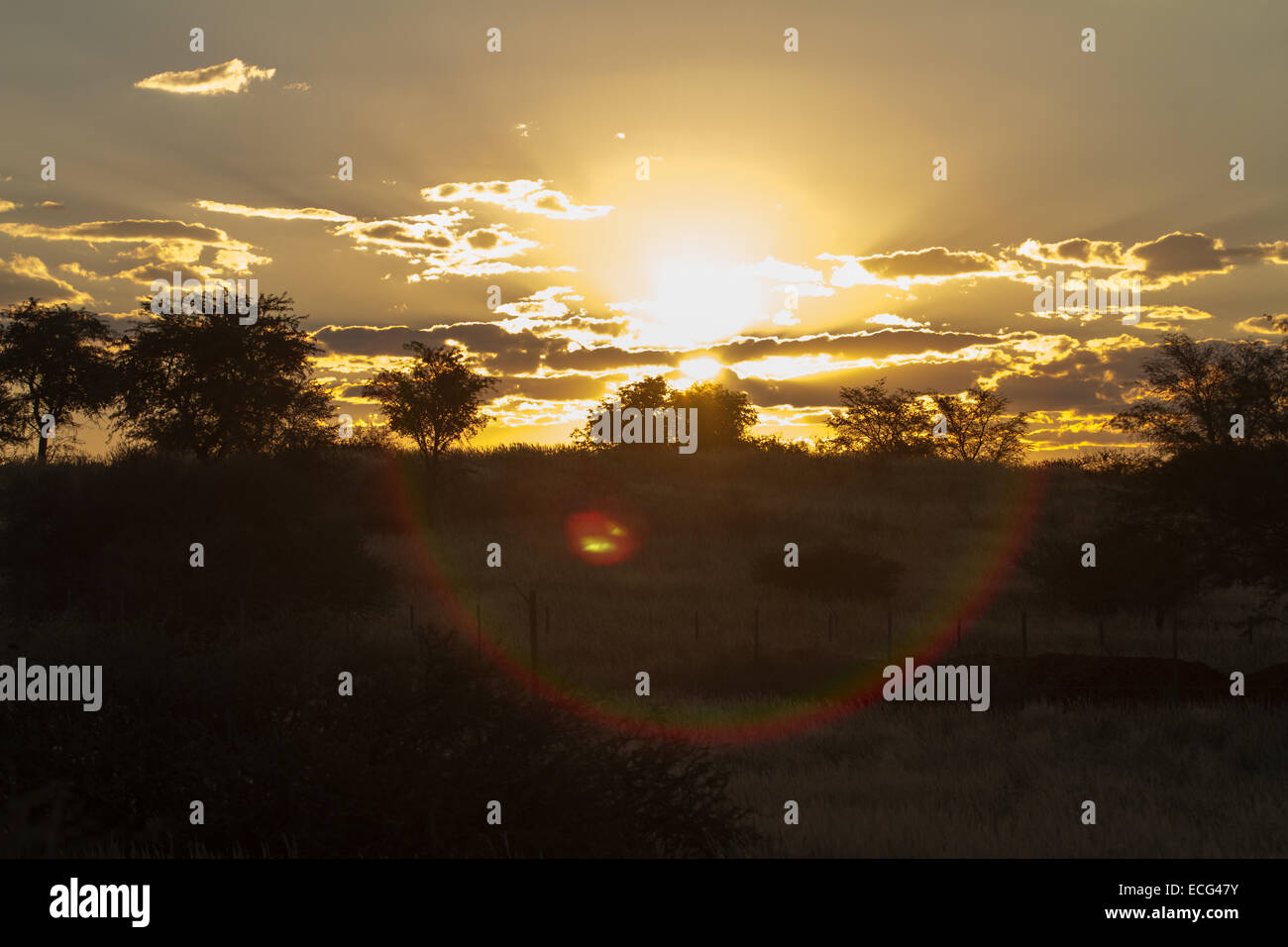 Sun dropping down the hill in a african landscape Stock Photo - Alamy