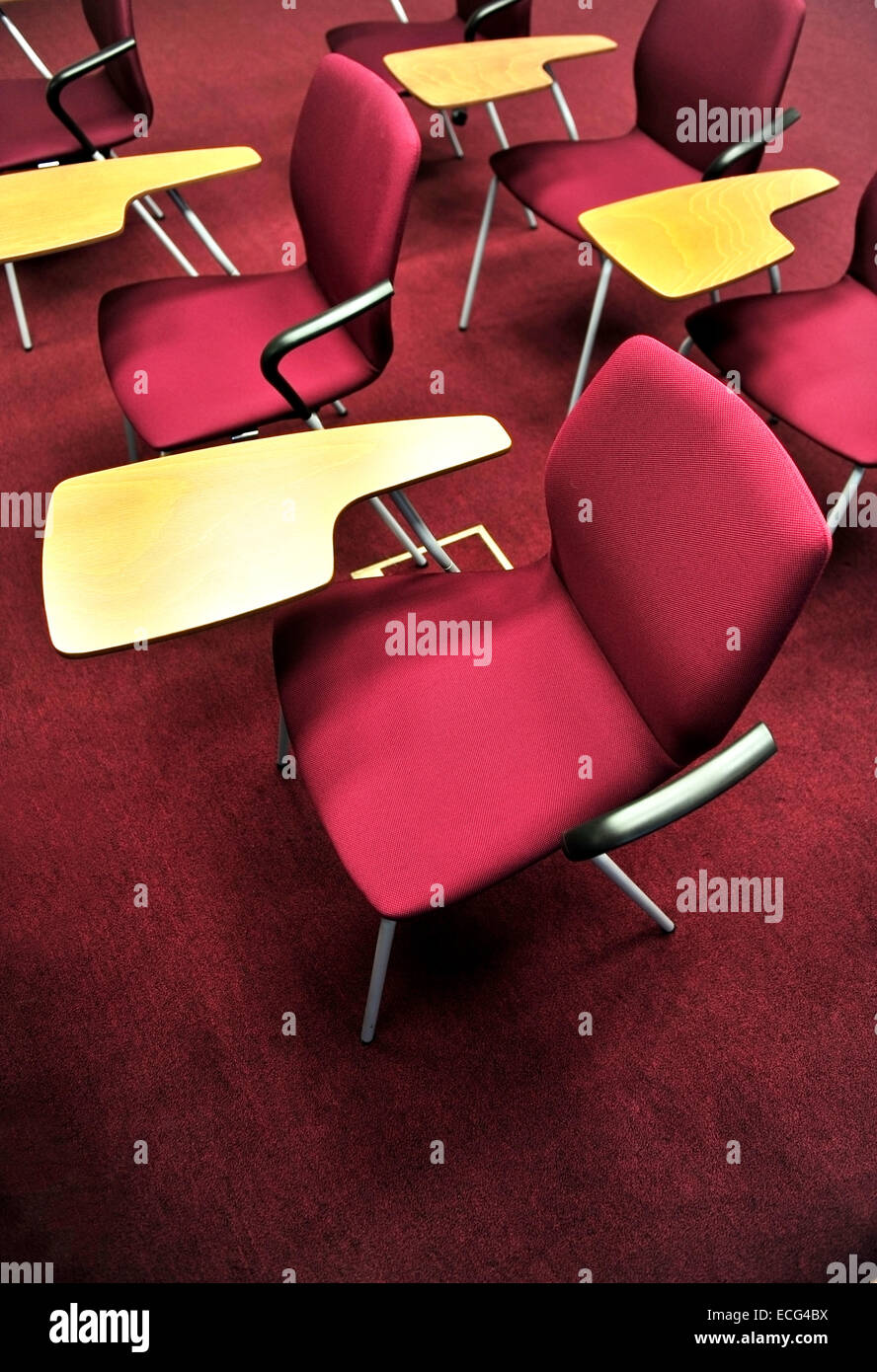 Empty chairs with wooden writing pad in a conference room Stock Photo ...