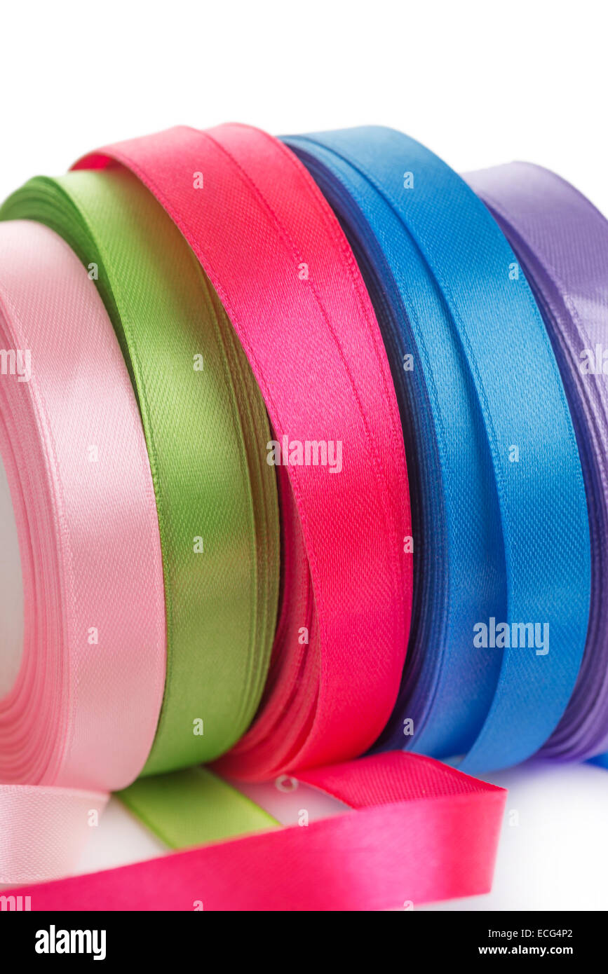 colored satin ribbons in a roll isolated on white background Stock ...