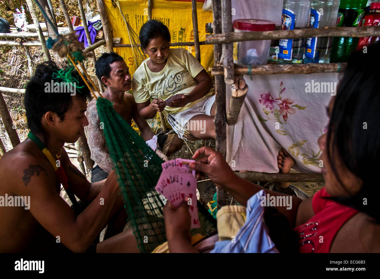 Miners play cards with their families and friends, as the usual pastime ...