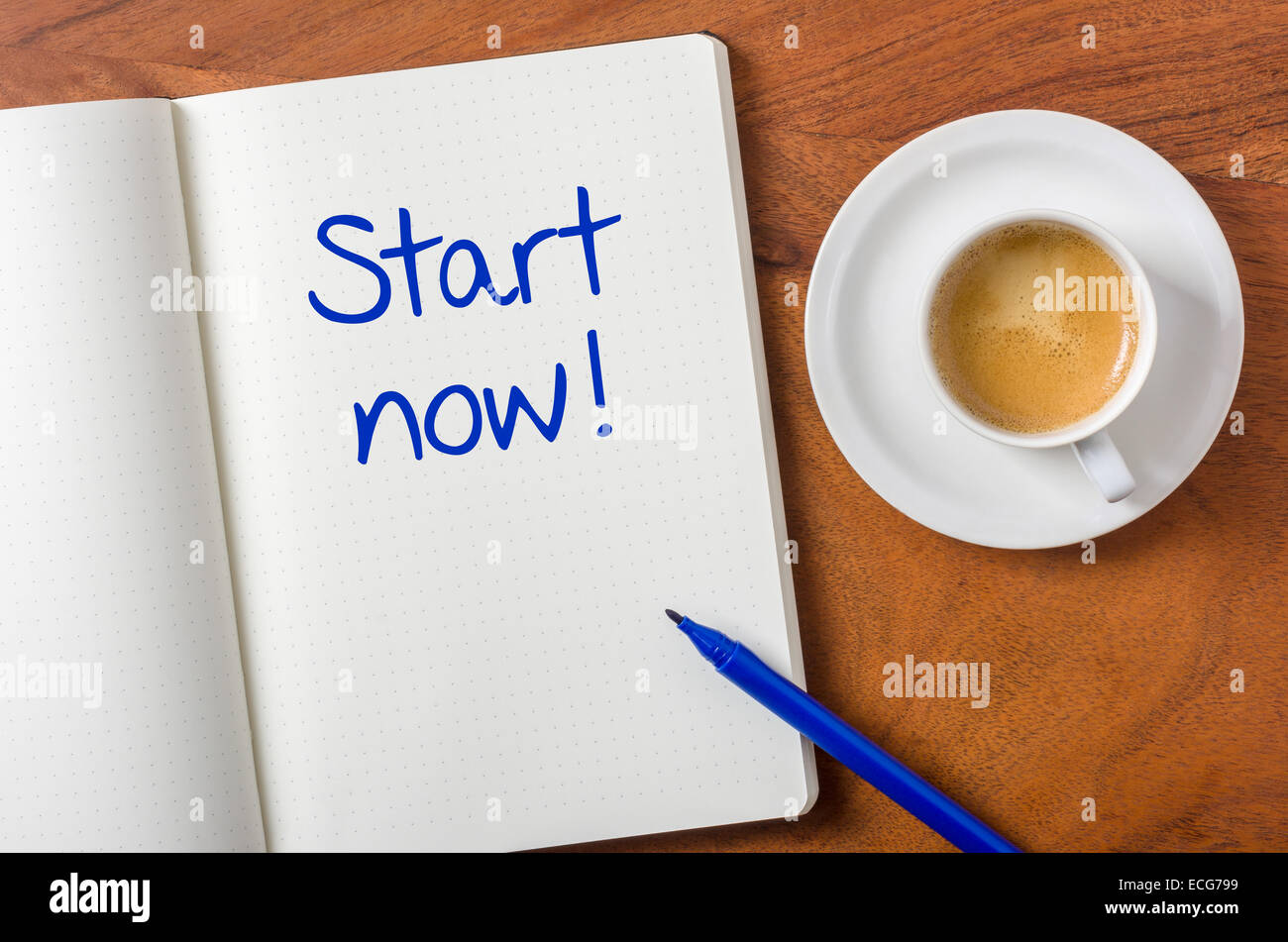 Notebook on a desk - Start now Stock Photo - Alamy