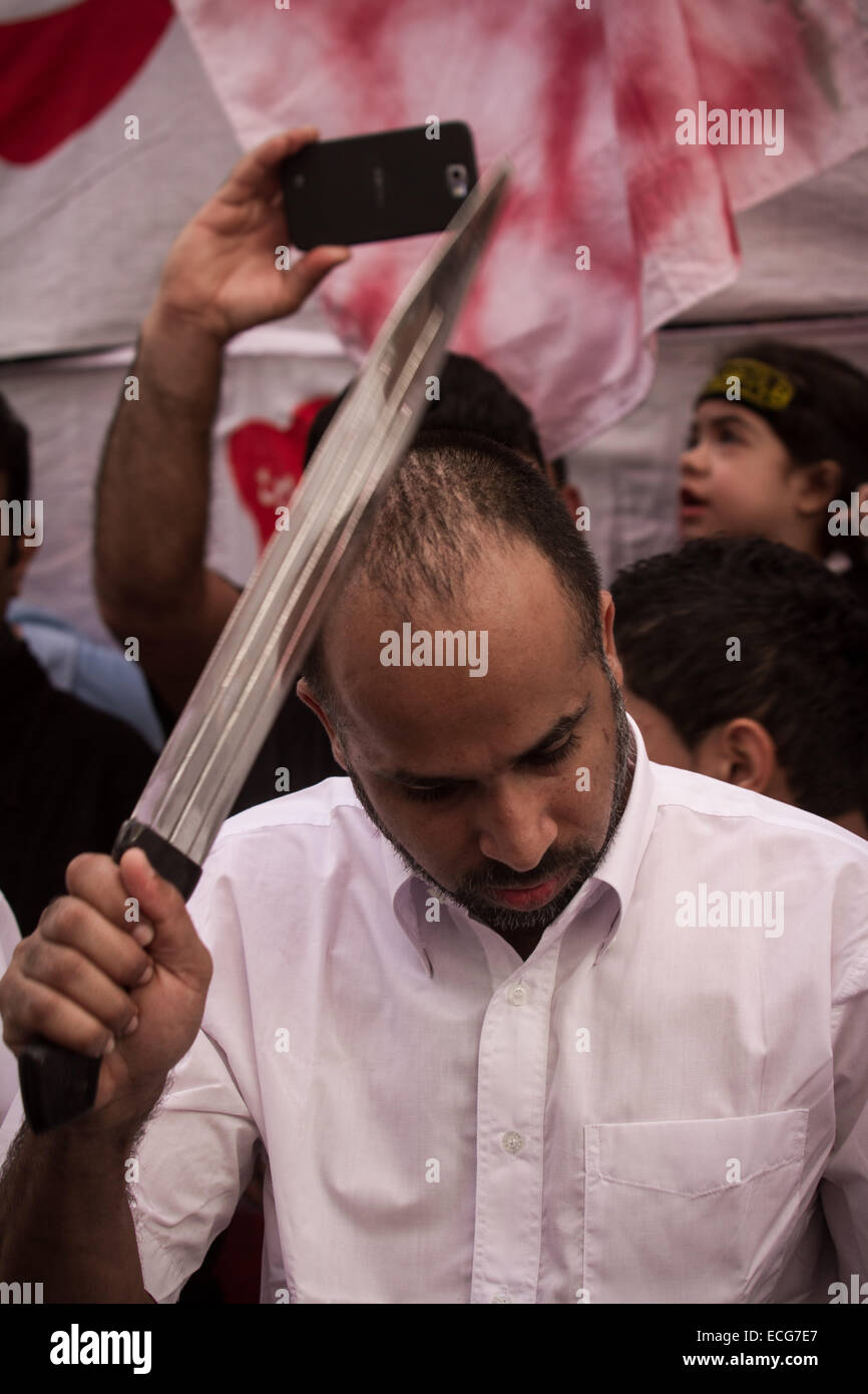 Male Shia Muslims take part in ceremonial chest beating parade as a ...
