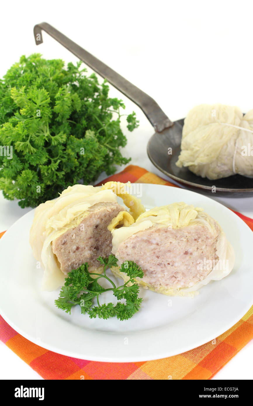Savoy cabbage roulade with parsley against white background Stock Photo ...