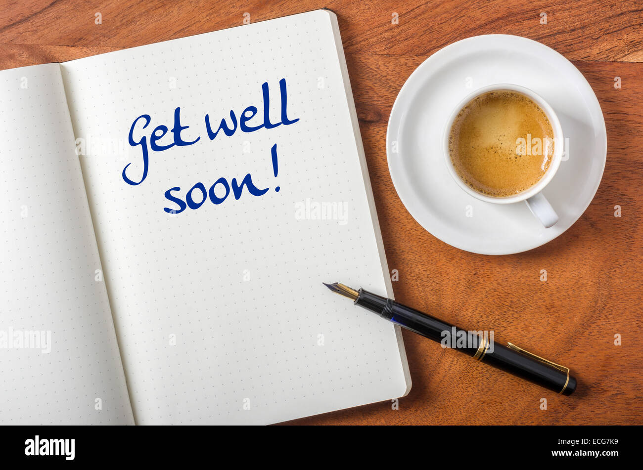 Notebook on a desk - Get well soon Stock Photo - Alamy