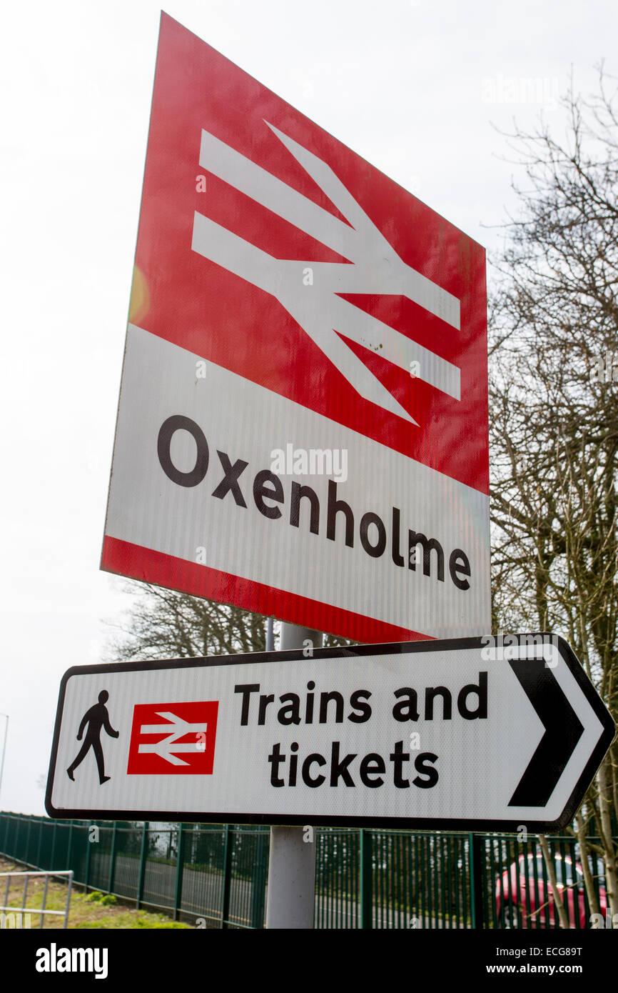 Oxenholme railway station sign and Trains & Tickets sign Stock Photo ...