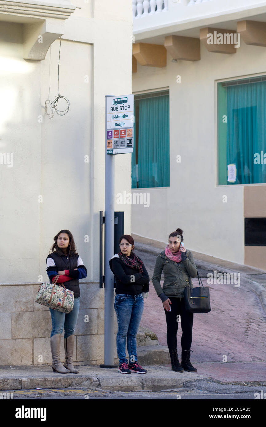 Women waiting at the bus stop hi-res stock photography and images - Alamy