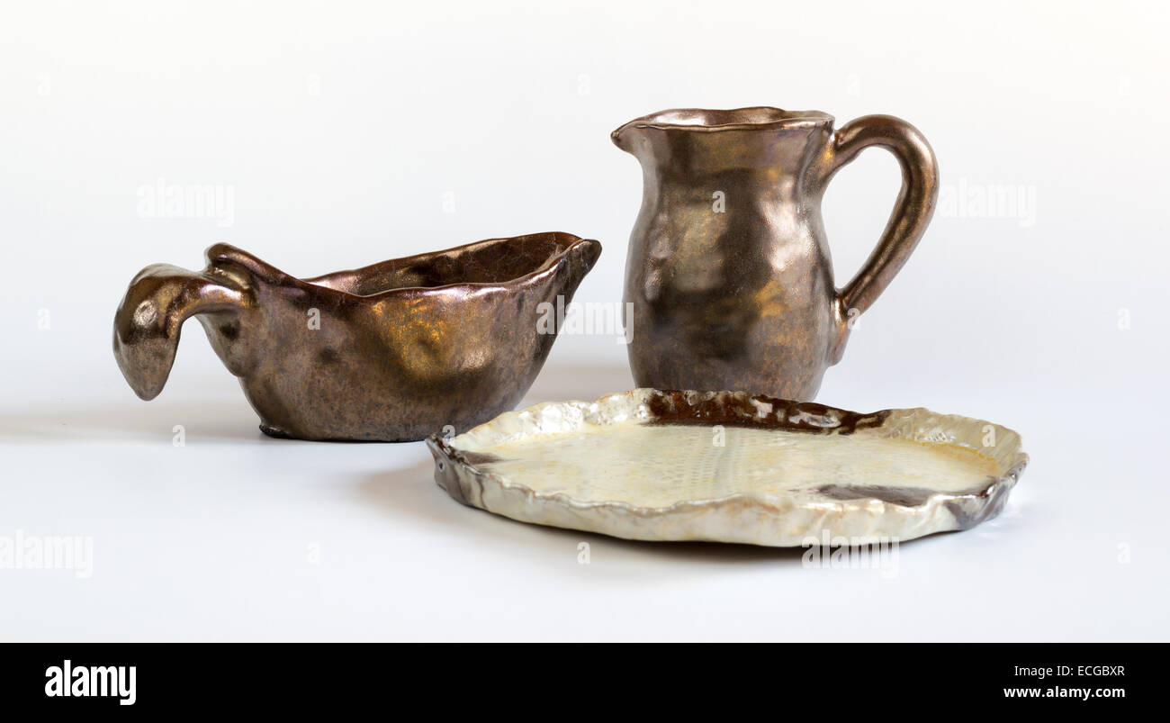 Set of Gold Handmade Clay Vessels on White Background Stock Photo - Alamy