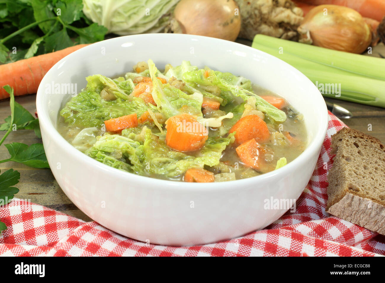 a bowl of savoy cabbage stew with vegetables Stock Photo - Alamy