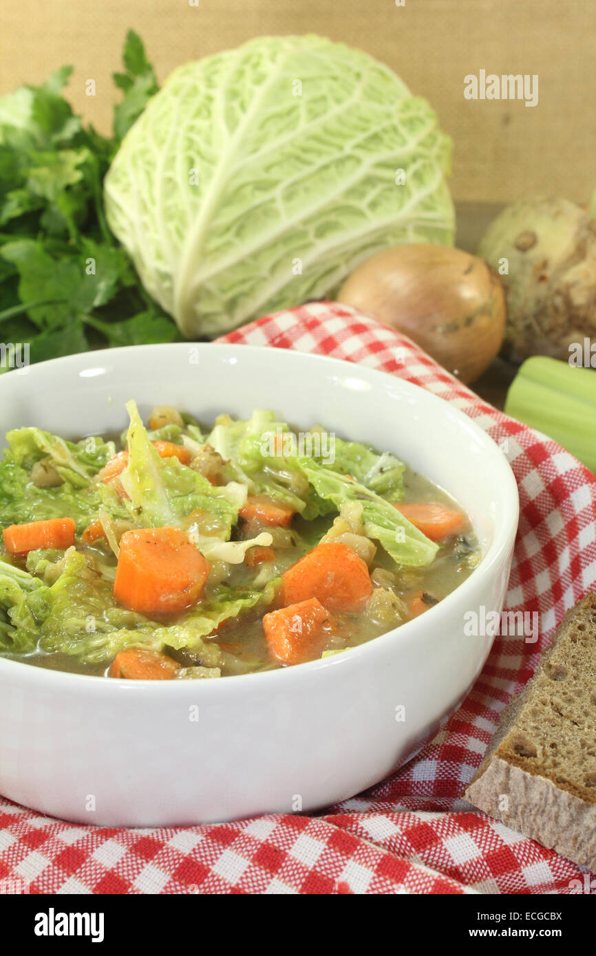 a bowl of savoy cabbage stew with vegetables Stock Photo - Alamy