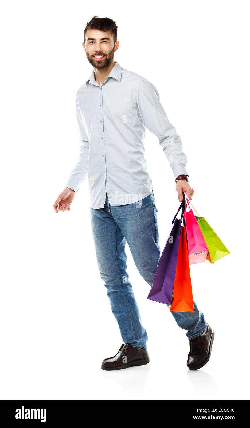 Handsome man holding shopping bags. Christmas and holidays concept ...