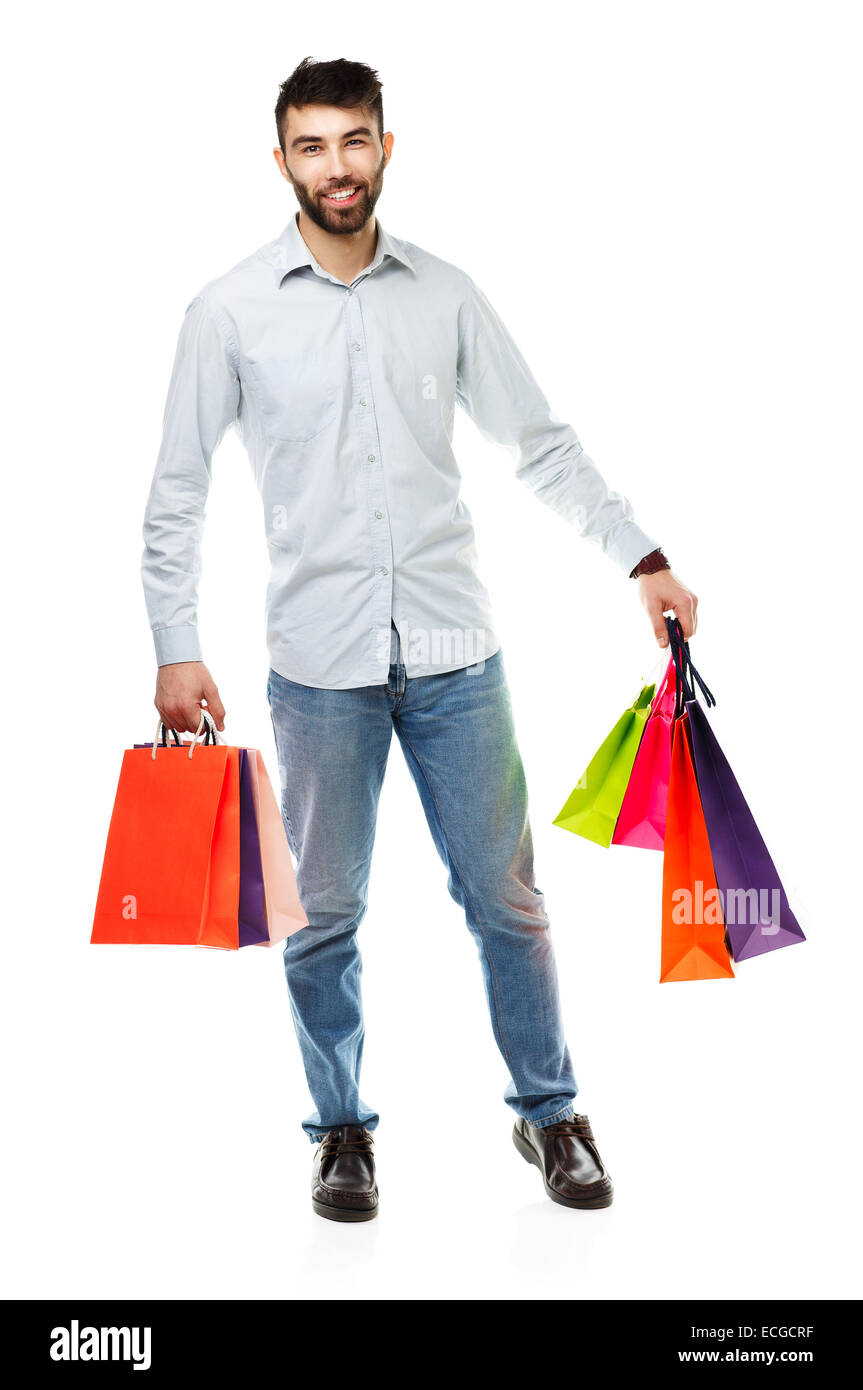 Handsome man holding shopping bags. Christmas and holidays concept ...