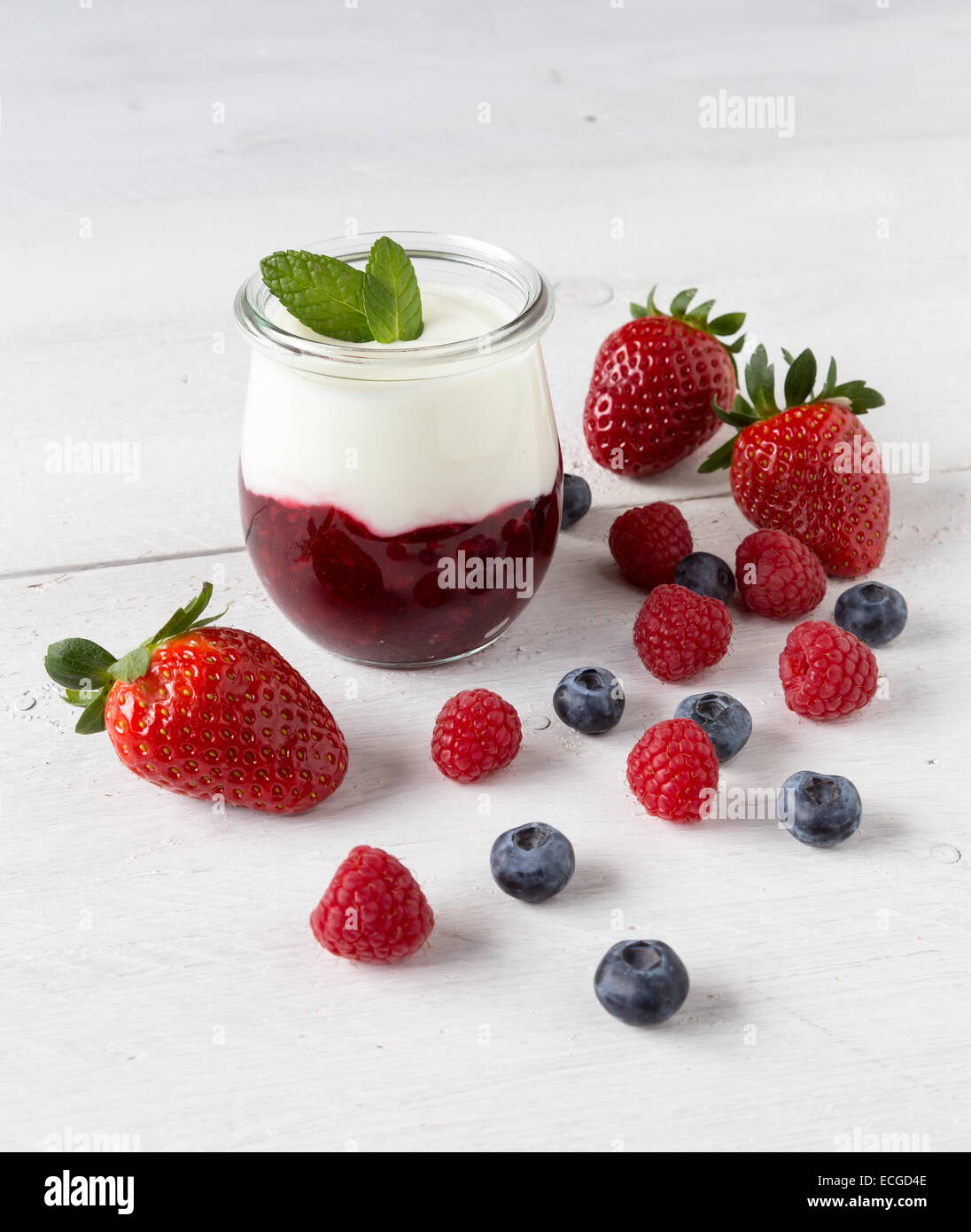 Red fruit compote with mint leaves and fruit Stock Photo - Alamy