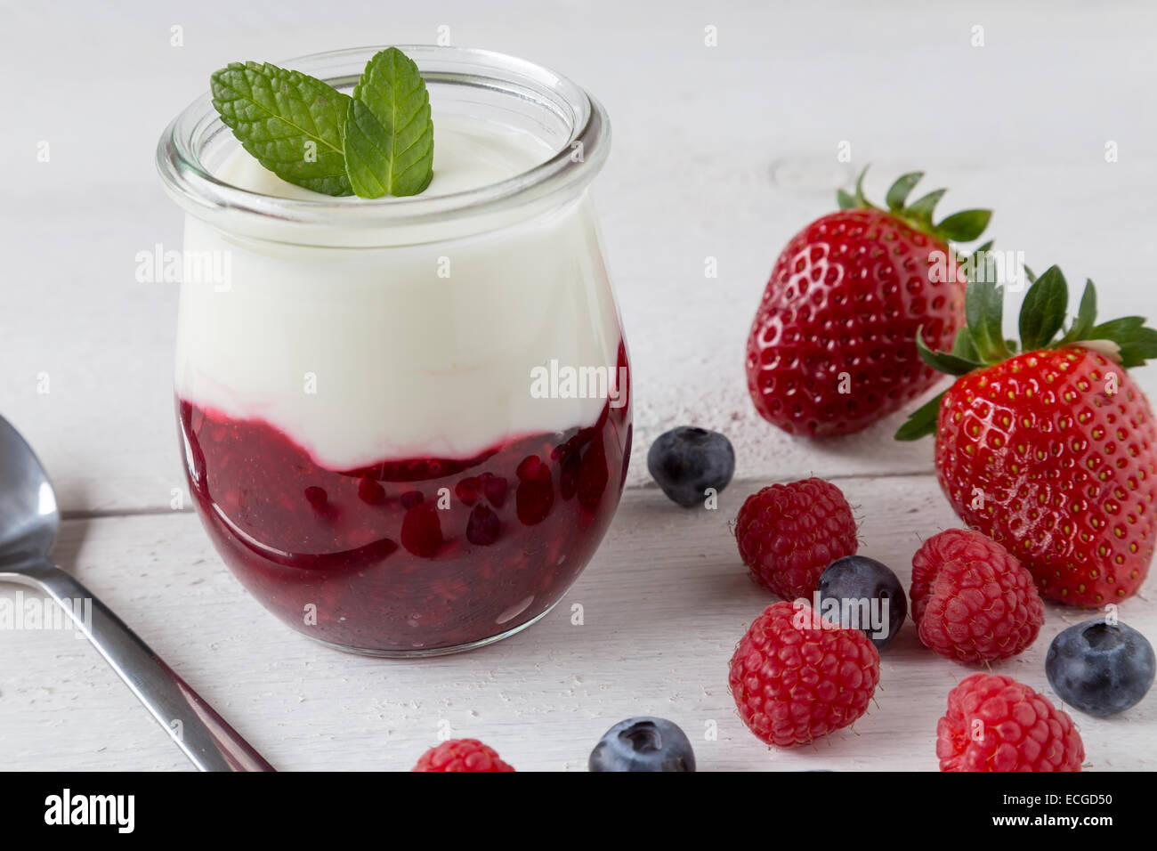 Red fruit compote with mint leaves and fruit Stock Photo - Alamy