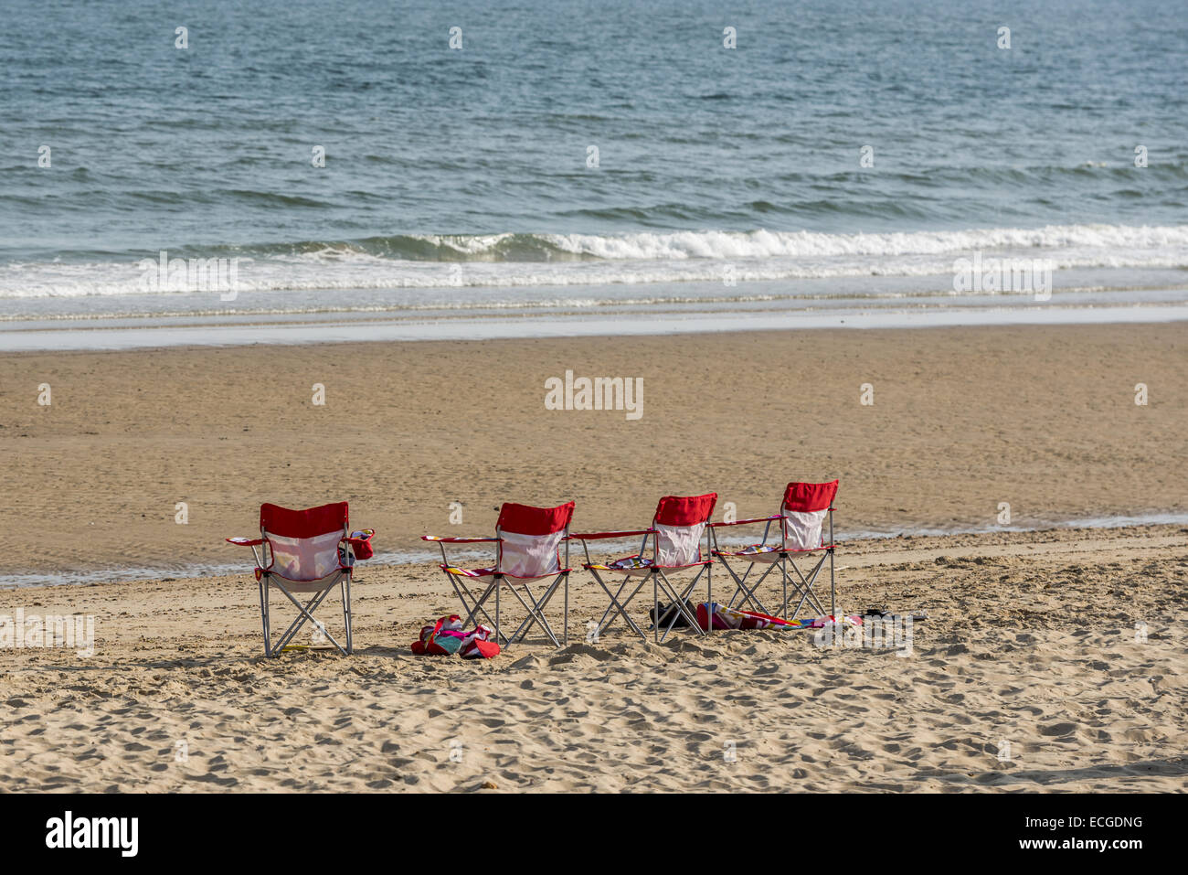 Four empty chairs on the beach at Poole, Dorset, UK Stock Photo - Alamy
