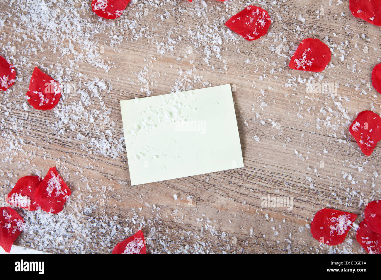 on a wooden background a yellow sticky notes with no text. Decorated ...