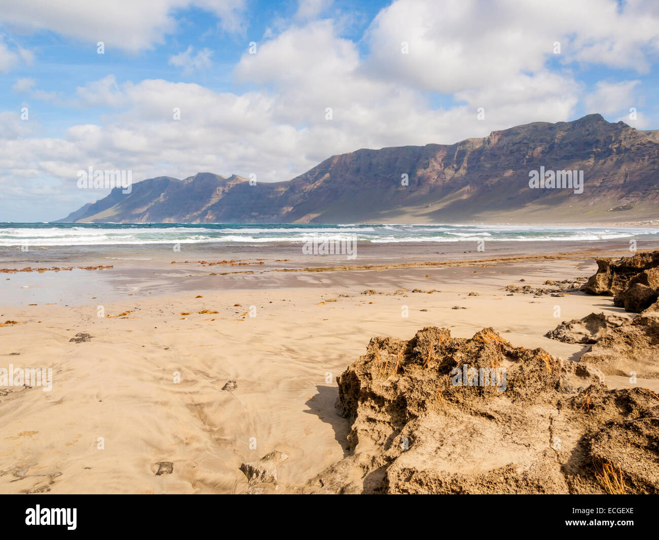 Playa de Famara deserted beach with surf on the undeveloped North West ...